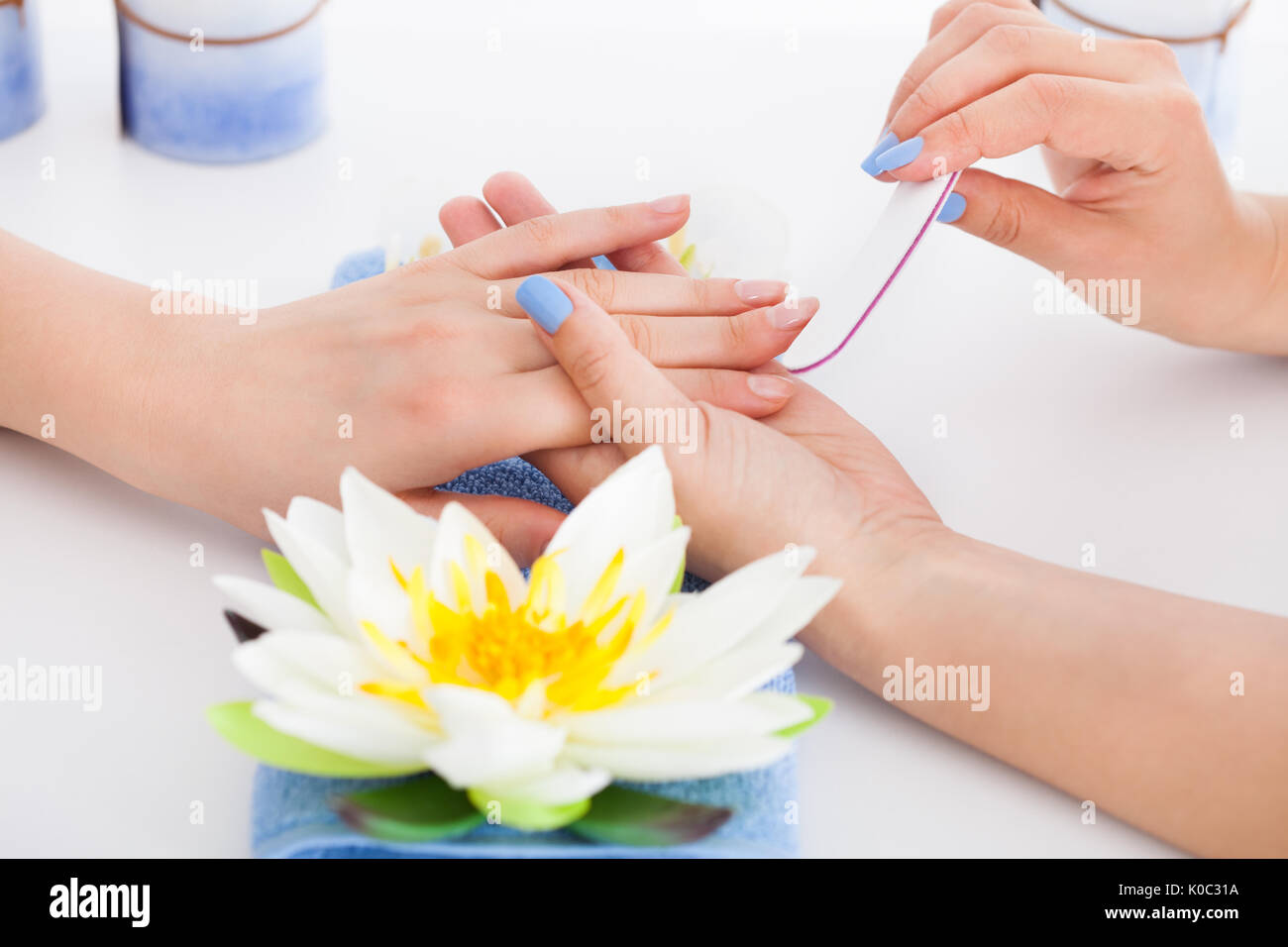 Womans hands filing nails hi-res stock photography and images - Alamy