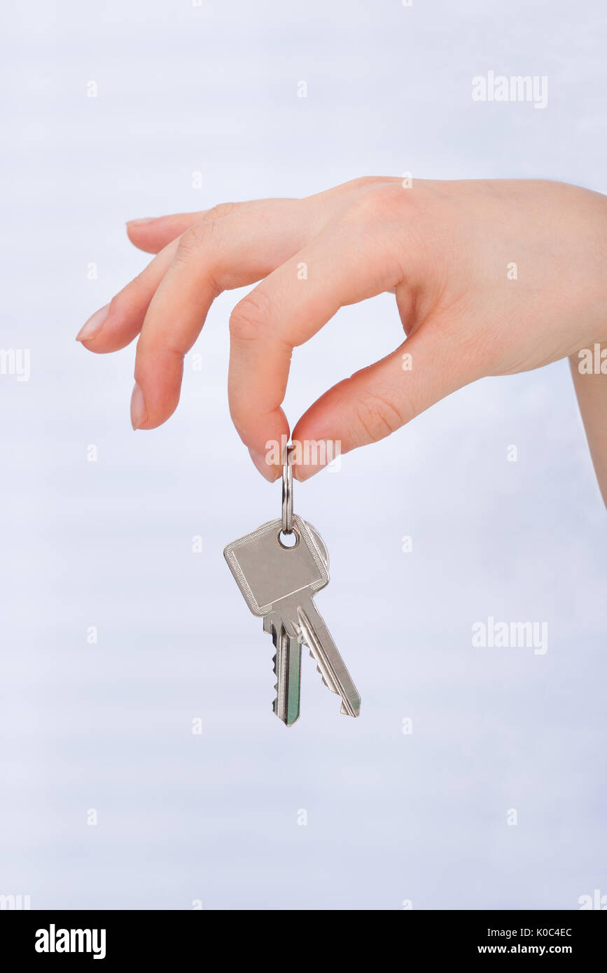 Closeup photo of woman's hand holding keys Stock Photo - Alamy