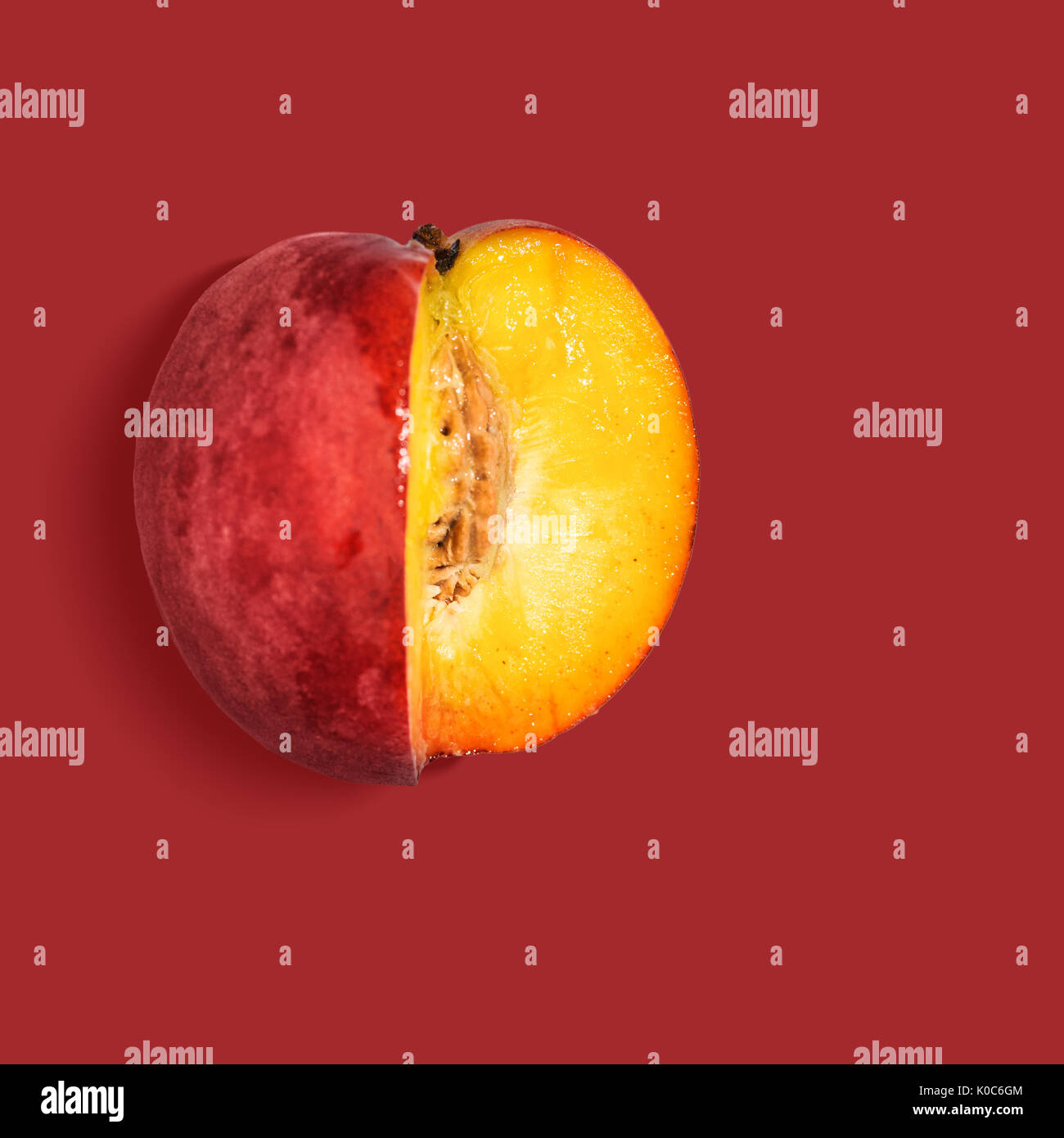 Fresh nectarine on red background, view from above Stock Photo - Alamy