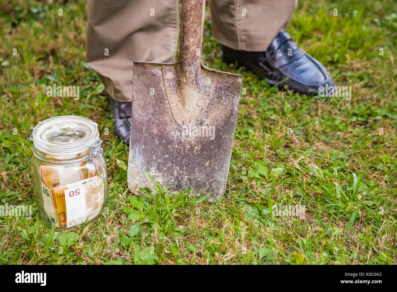 Man burying money hi-res stock photography and images - Alamy