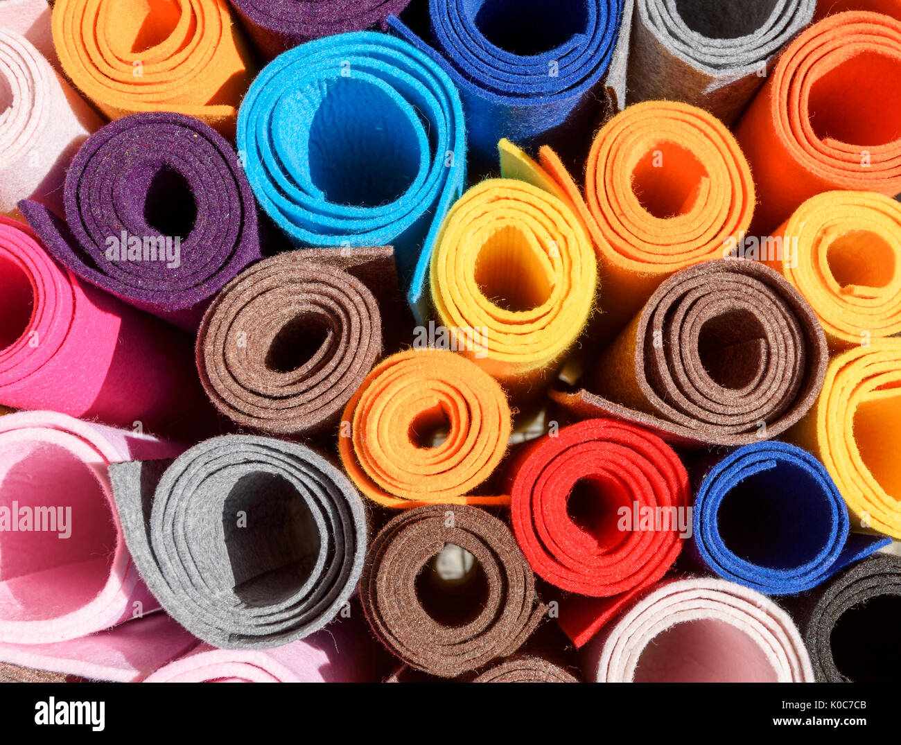 Rolls of colored paper standing next to each other Stock Photo - Alamy