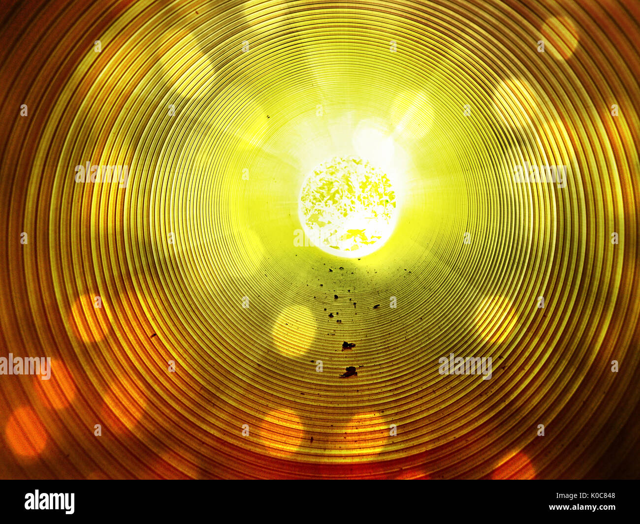 Film grain effect. View inside of long plastic tube under ground ...