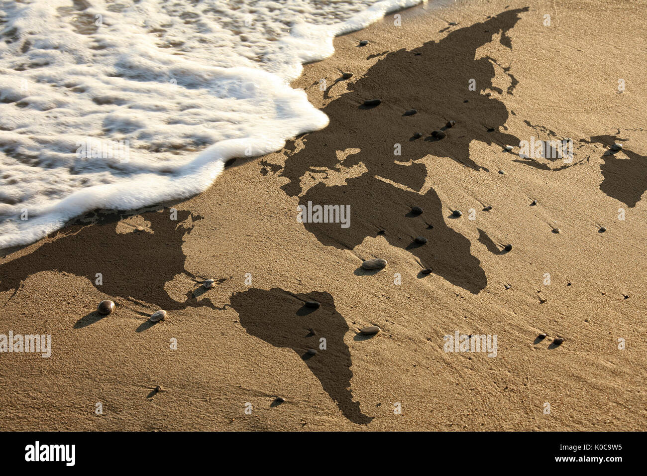 elevated view of conceptual world map on beach. Furnished NASA flat ...