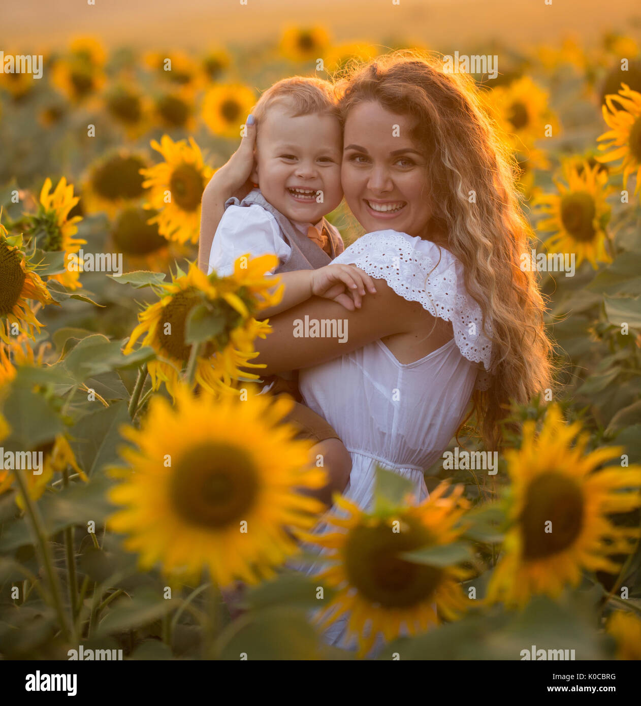 Child baby sunflower flower hi-res stock photography and images - Alamy