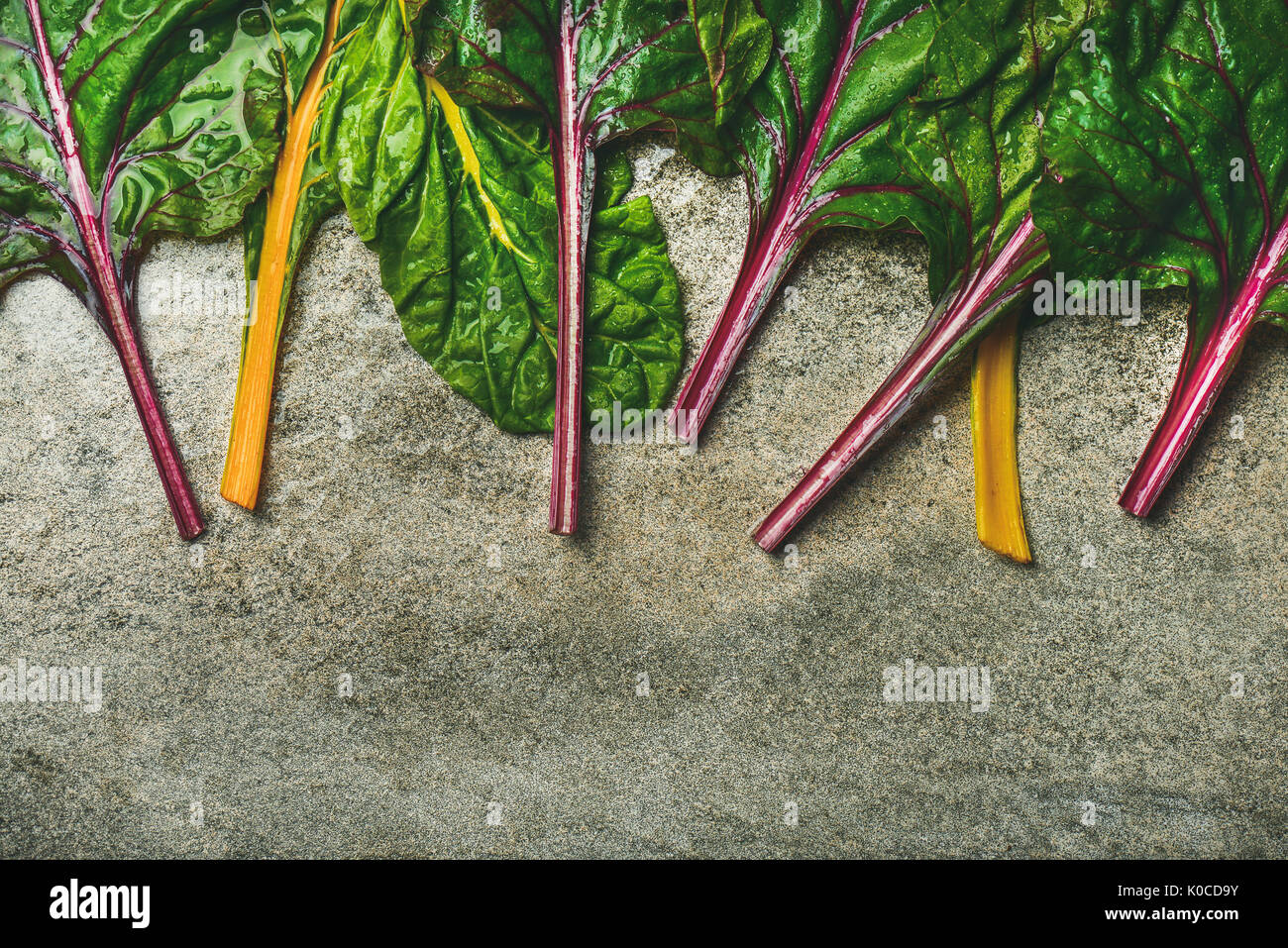 Flat-lay of fresh leaves of swiss chard over concrete background Stock ...