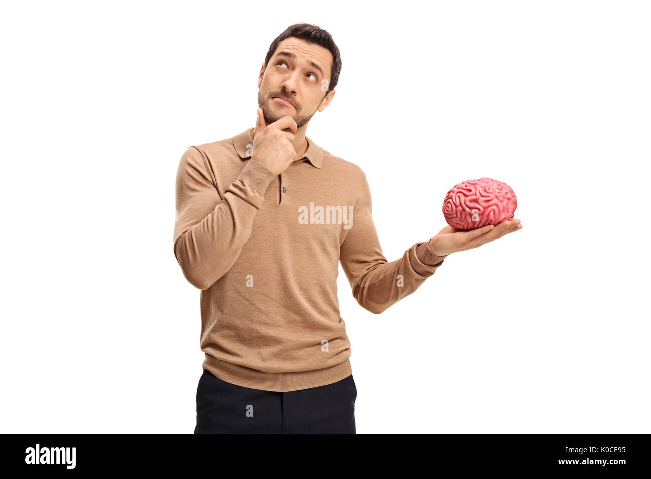 Thoughtful man holding a brain model isolated on white background Stock ...
