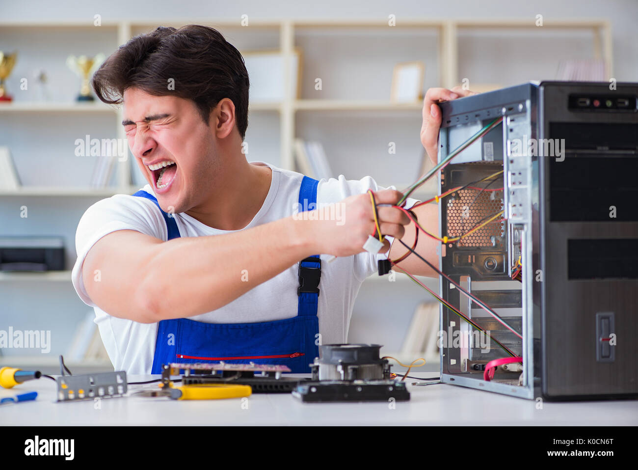 Computer repairman repairing desktop computer Stock Photo - Alamy