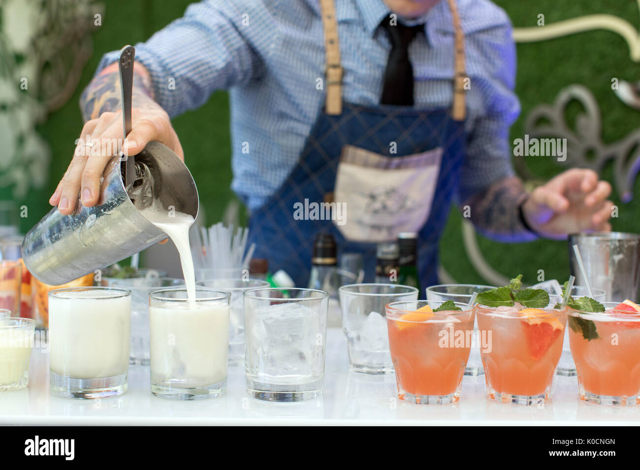 Bartender pouring drinks at party Stock Photo - Alamy