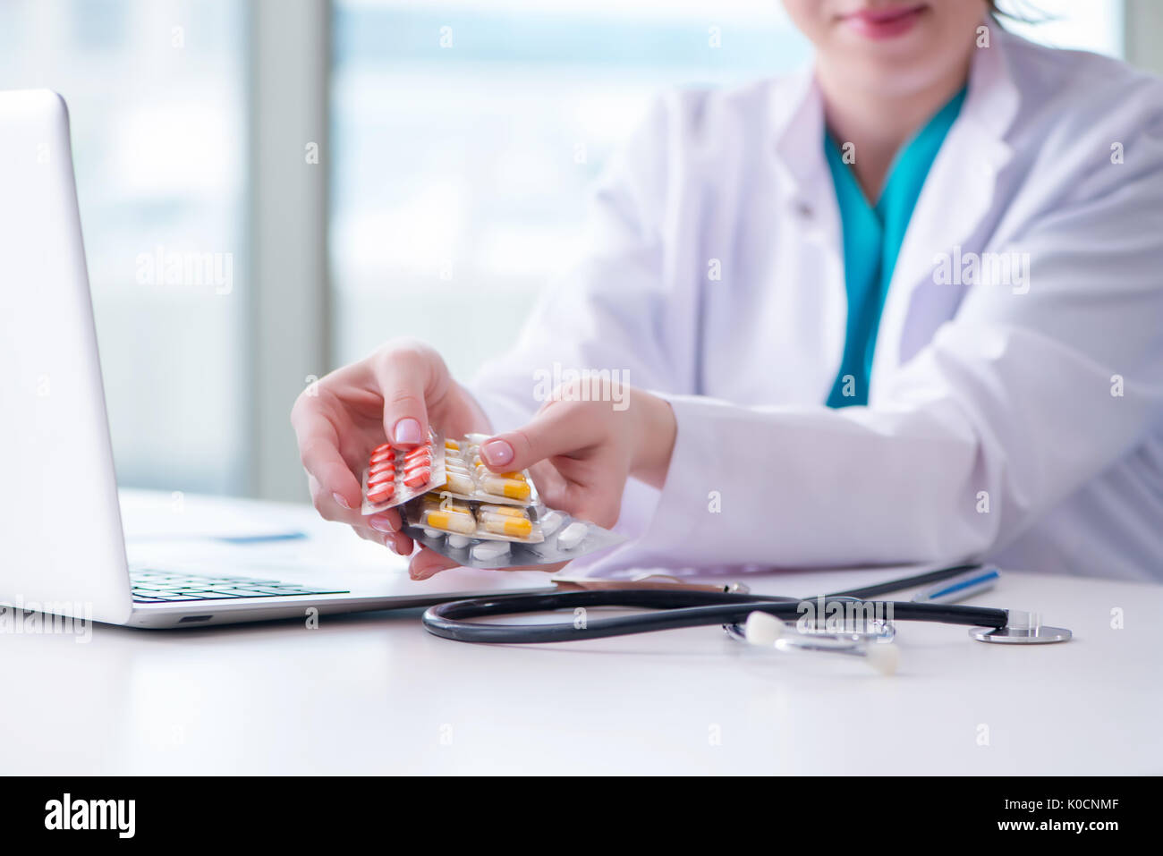 Medical concept with medicines and laptop computer Stock Photo - Alamy