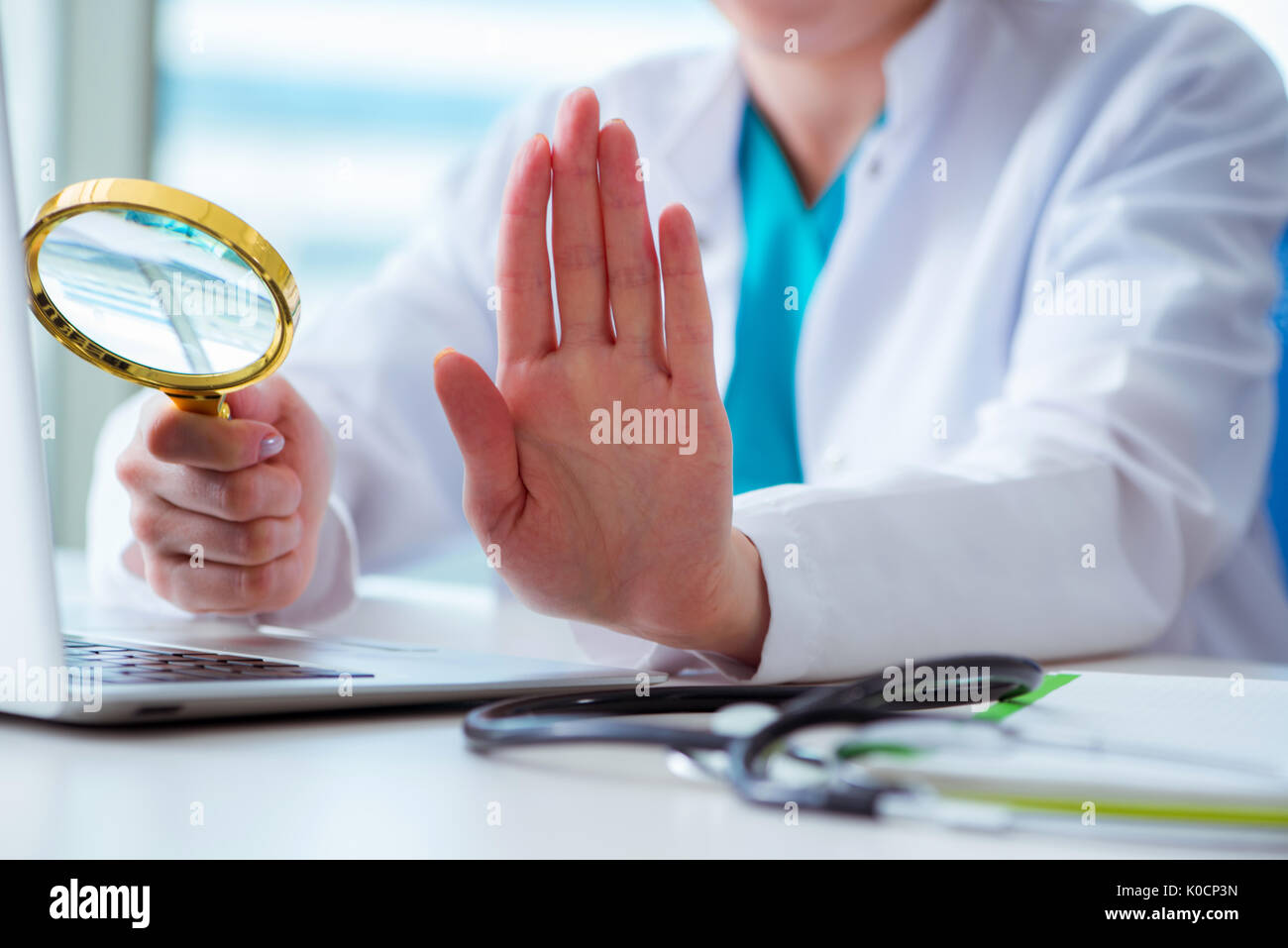 Doctor hand with magnifying glass Stock Photo - Alamy
