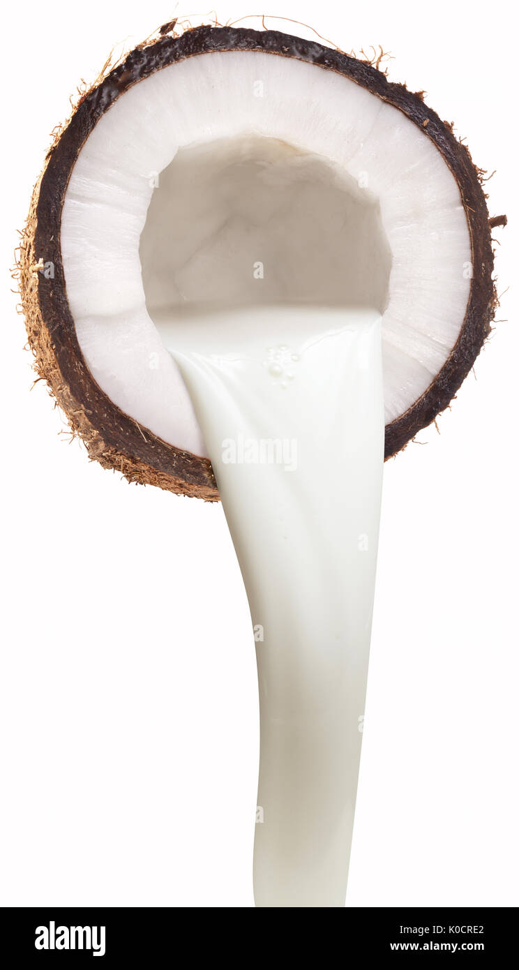 Coconut milk pouring out of coconut fruit. Clipping path Stock Photo ...