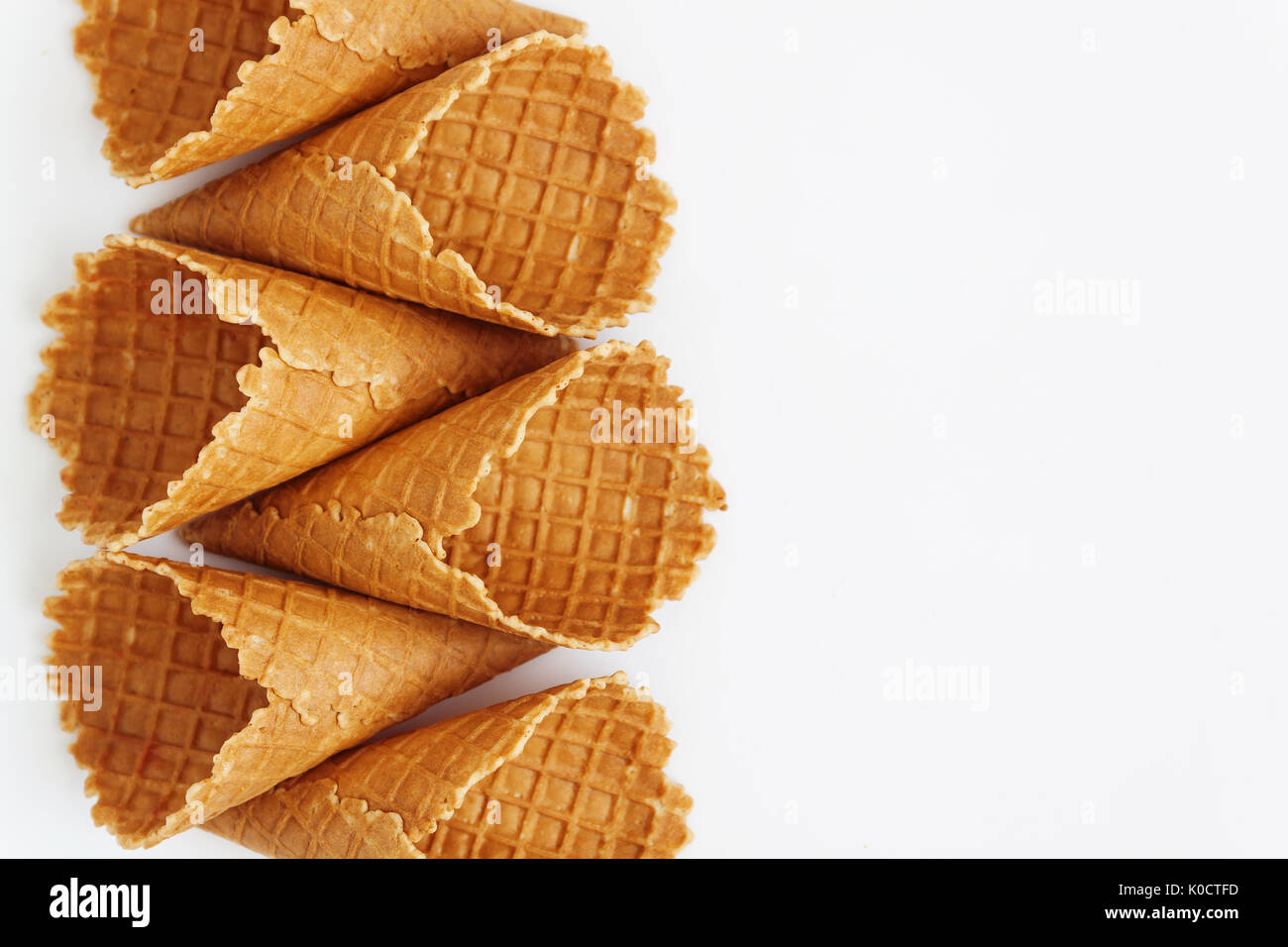Several waffle cones lined in tower, smile, or even row, top view ...