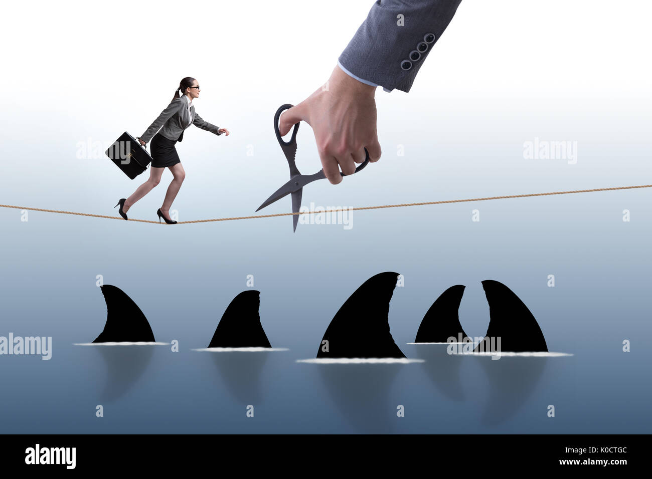 Hand cutting rope in business risk concept Stock Photo - Alamy