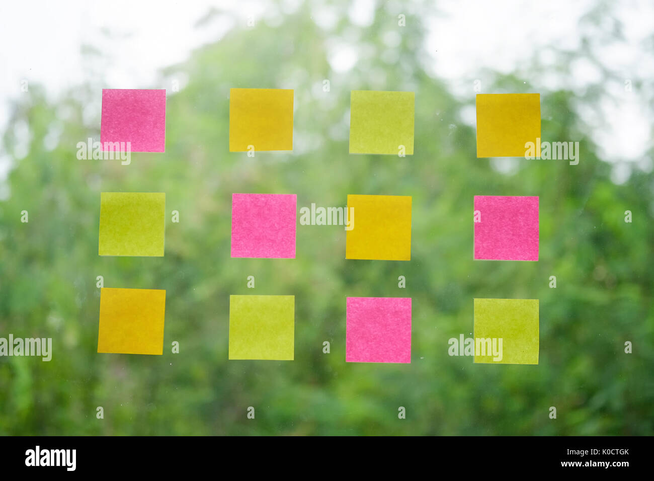 real post it notes to share idea and brainstorming concept on glass ...