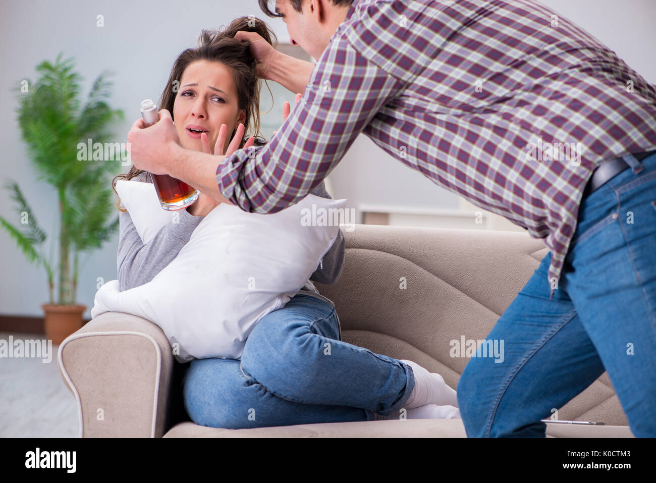 Domestic violence concept in a family argument with drunk alcoholic ...