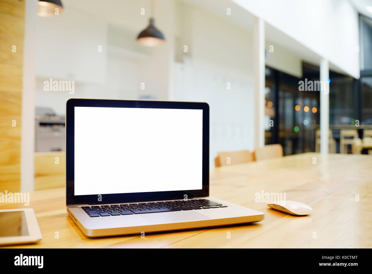 Laptop computer with empty screen on workspace Stock Photo - Alamy