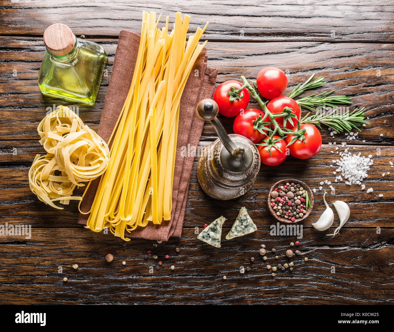 Pasta ingredients. Cherry-tomatoes, spaghetti pasta, rosemary and ...