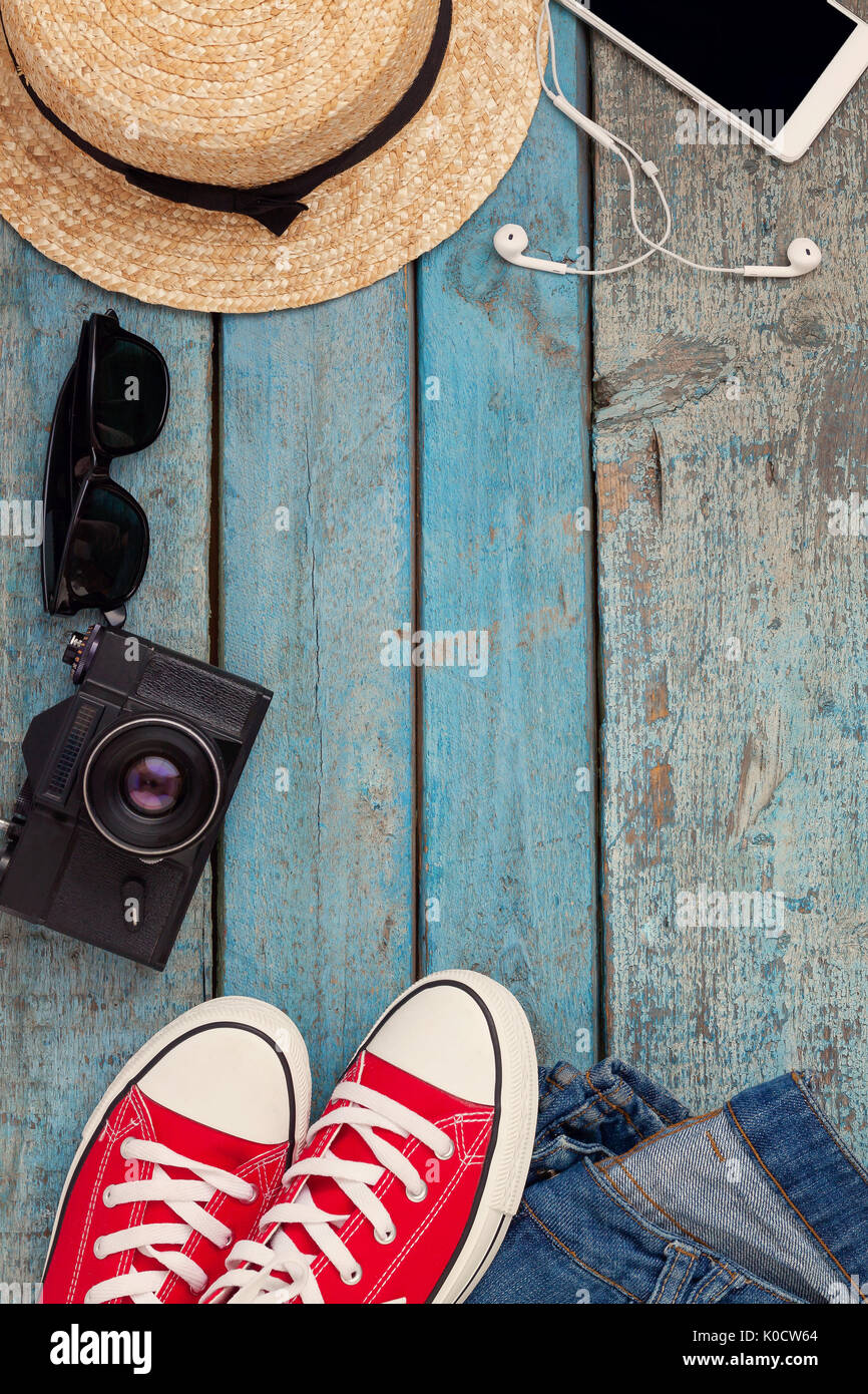 Still life of various items for recreation, clothing, hat, sneakers ...