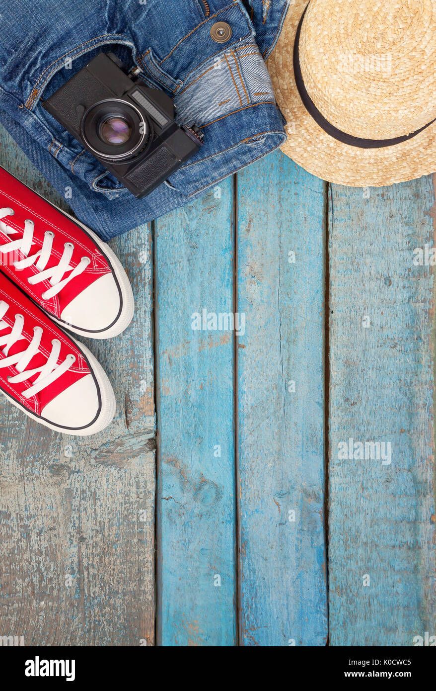 Still life of various items for recreation, clothing, hat, sneakers ...