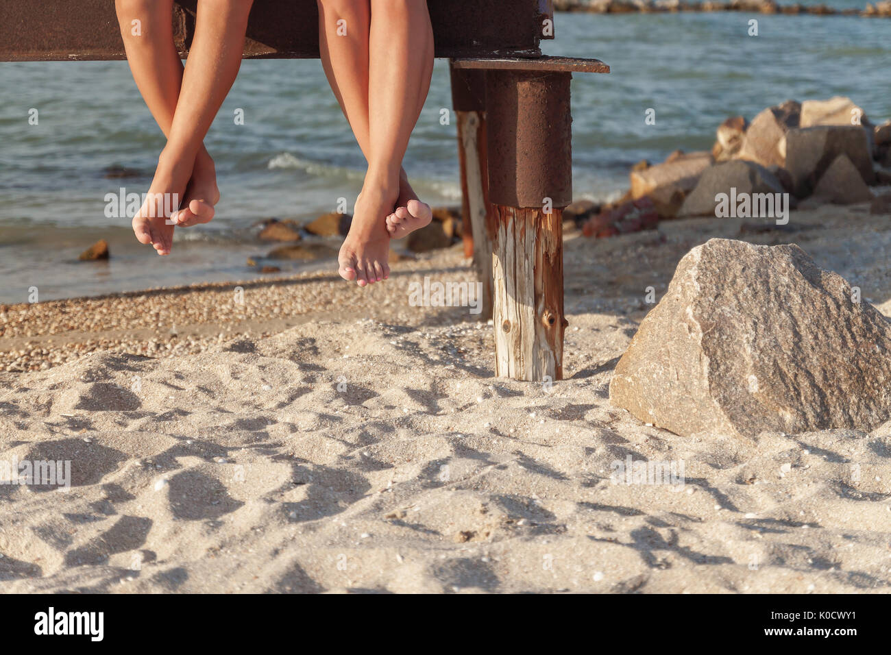 Child Legs Dangling High Resolution Stock Photography and Images - Alamy