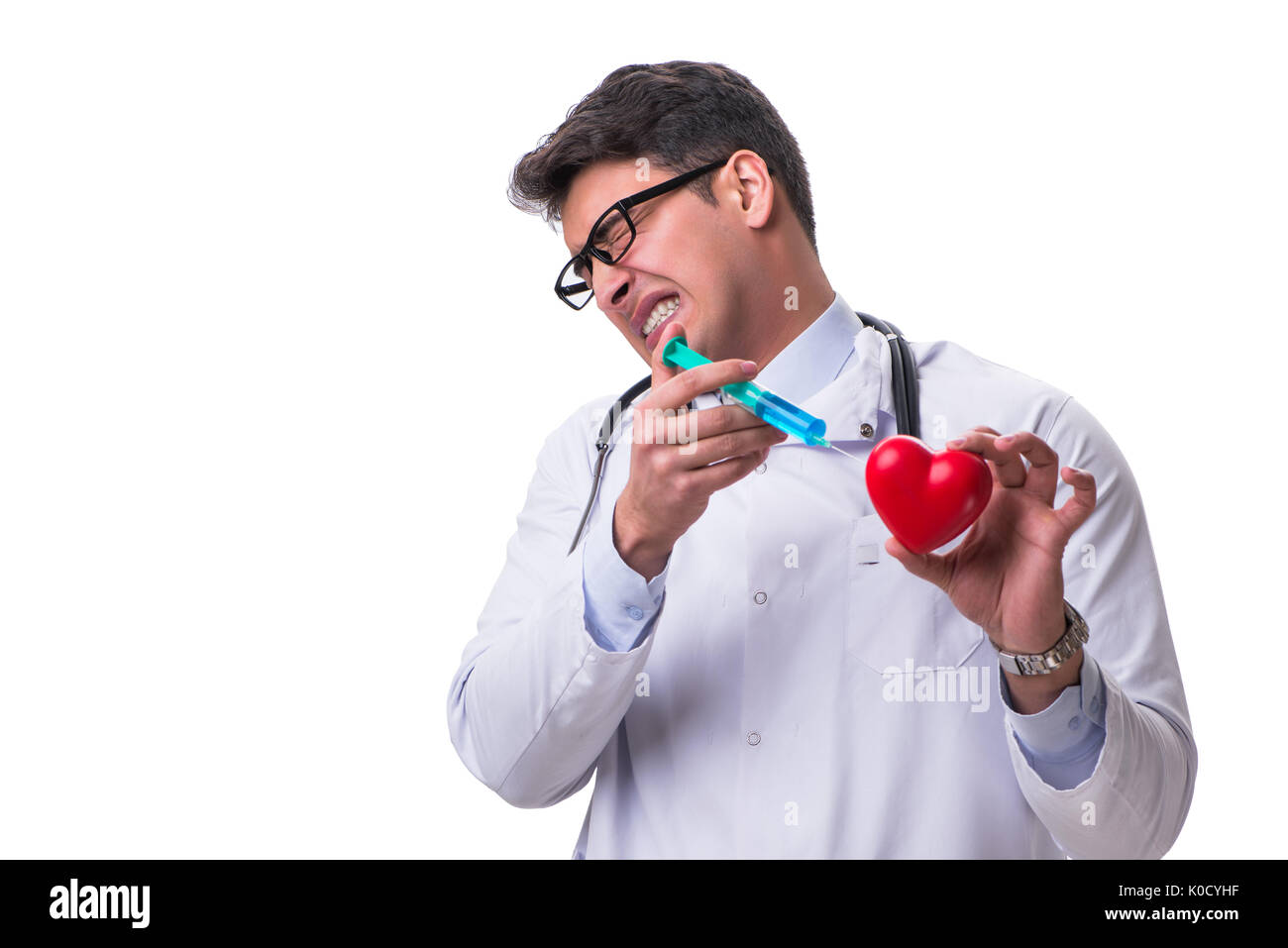 Young male cardiologist doctor holding a heart isolated on white ...