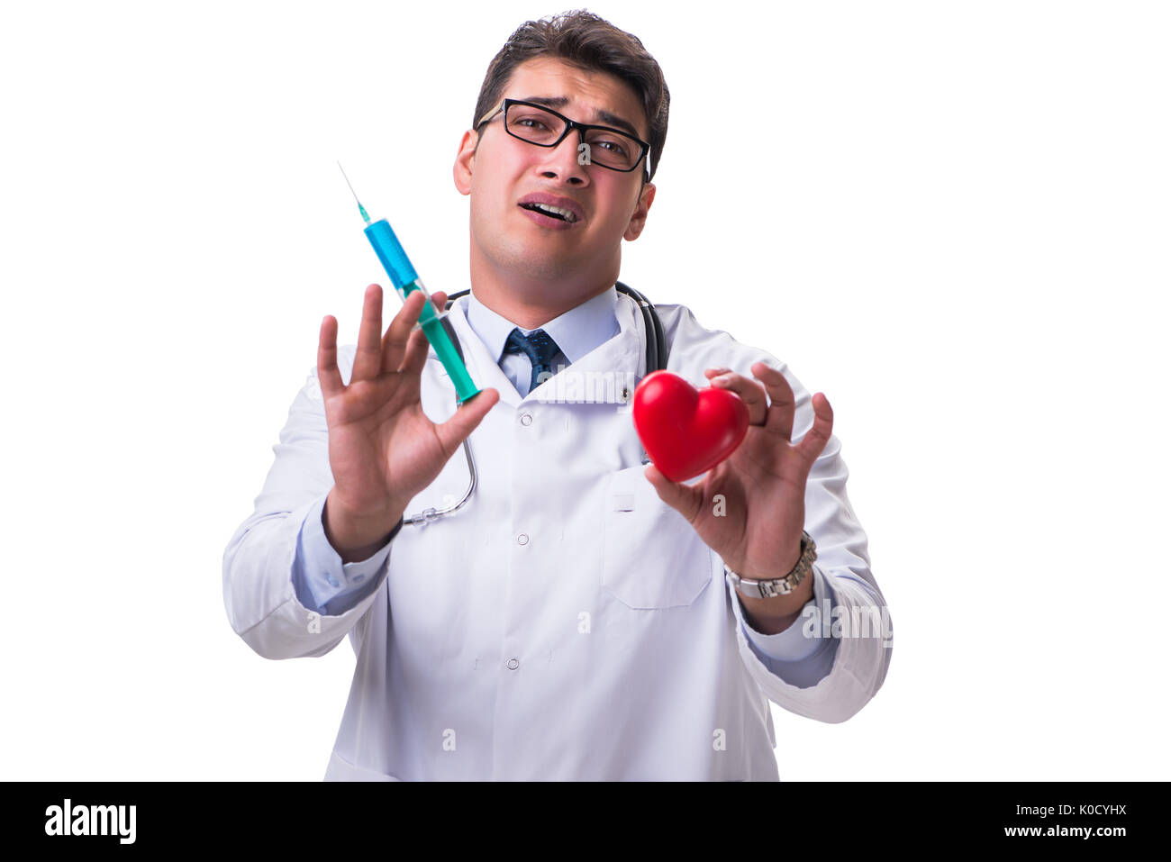 Young male cardiologist doctor holding a heart isolated on white ...