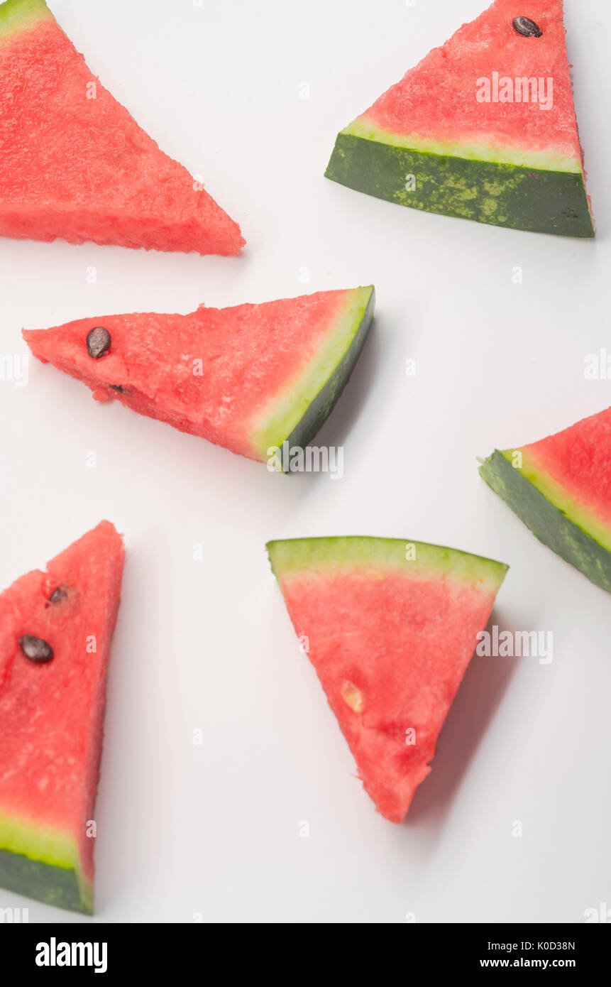 Different triangle pieces of red ripe watermelon on white background ...