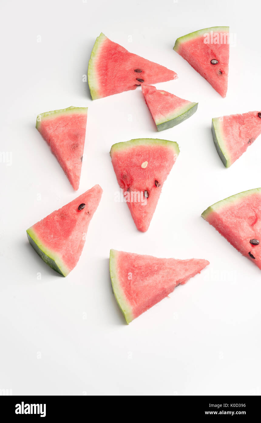 Different triangle pieces of red ripe watermelon on white background ...