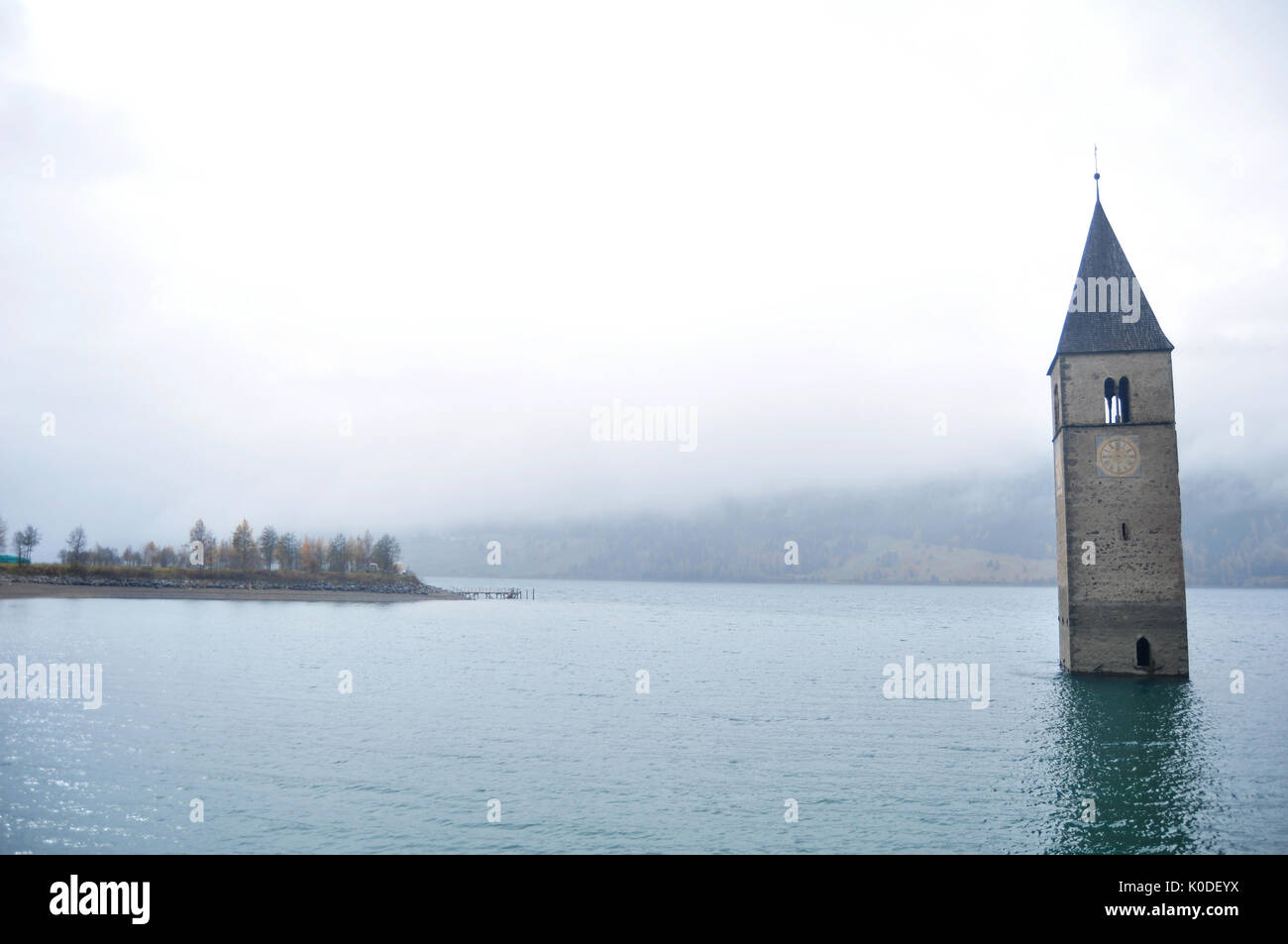 Submerged tower of reschensee church deep in Resias Lake in Trentino ...