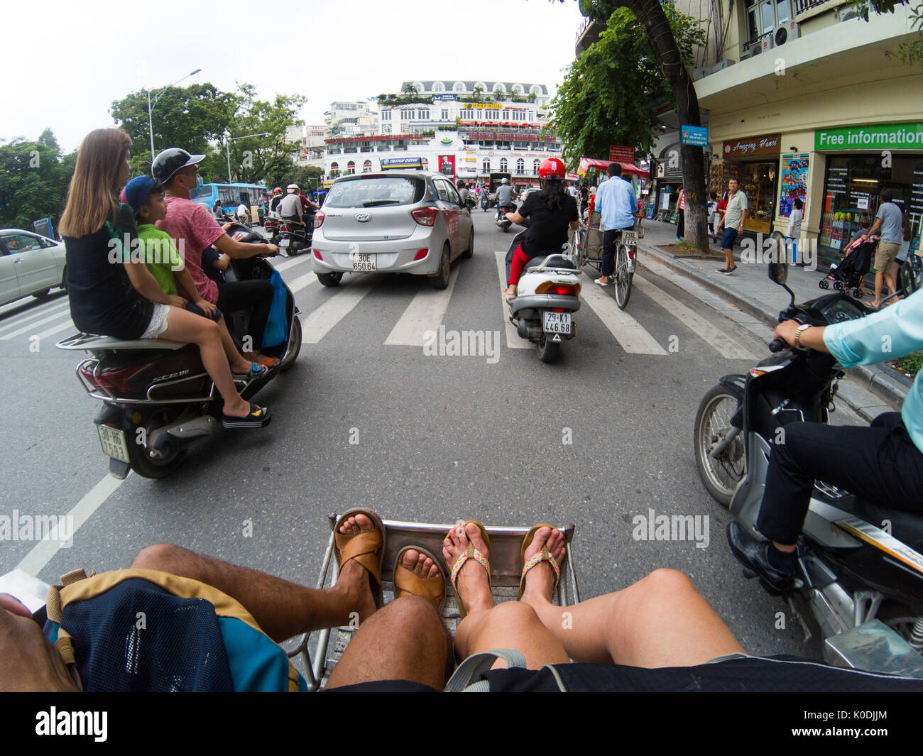 HANOI, VIETNAM - AUGUST 16, 2017: Tourists taking a cyclo ride through ...