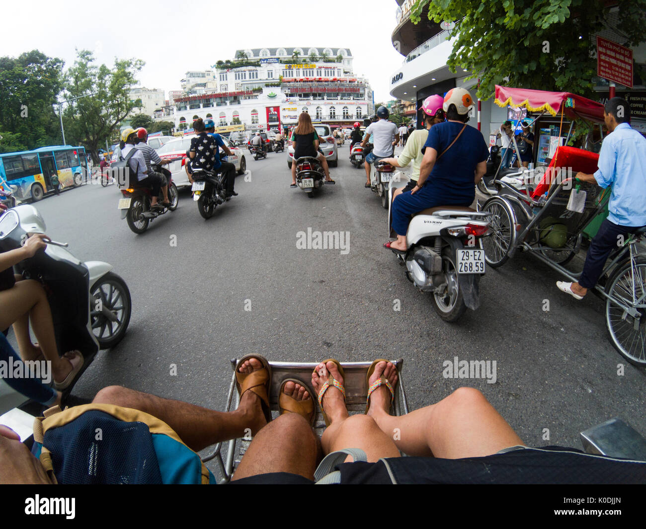 HANOI, VIETNAM - AUGUST 16, 2017: Tourists taking a cyclo ride through ...