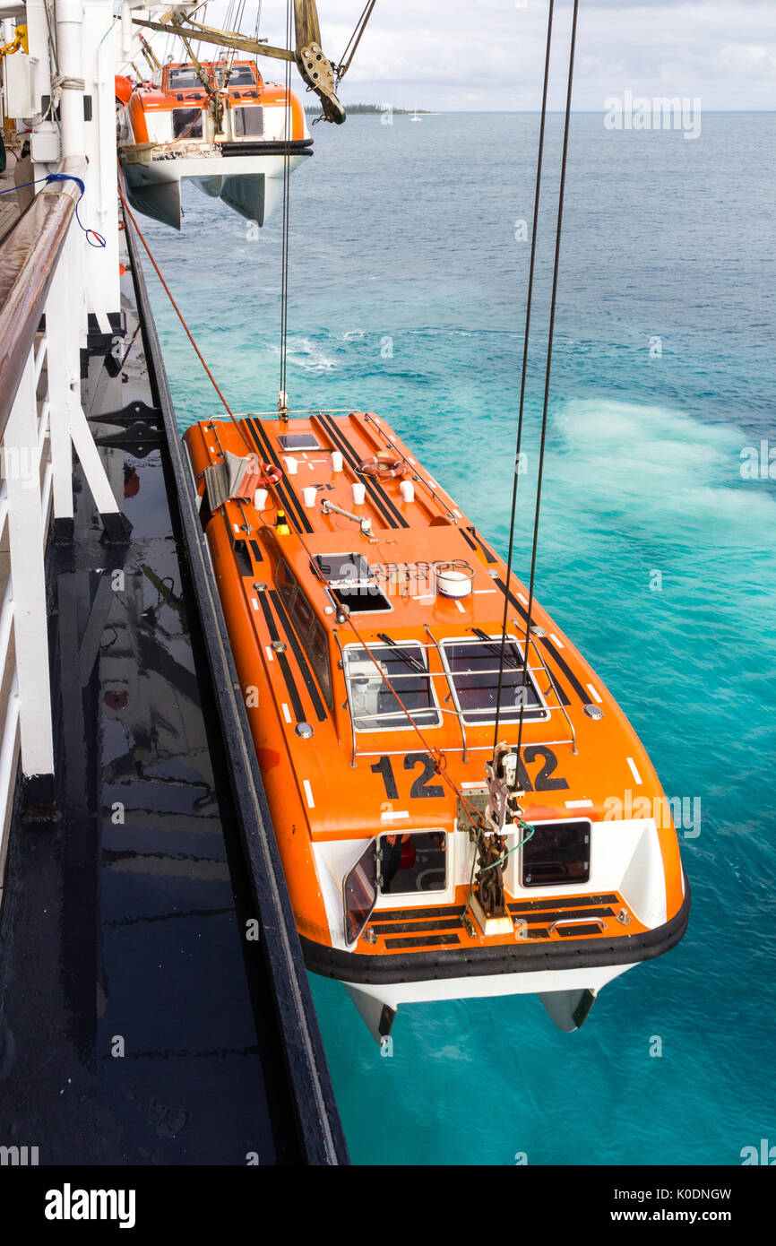 Tender being lowered from the Holland America line cruise ship ...