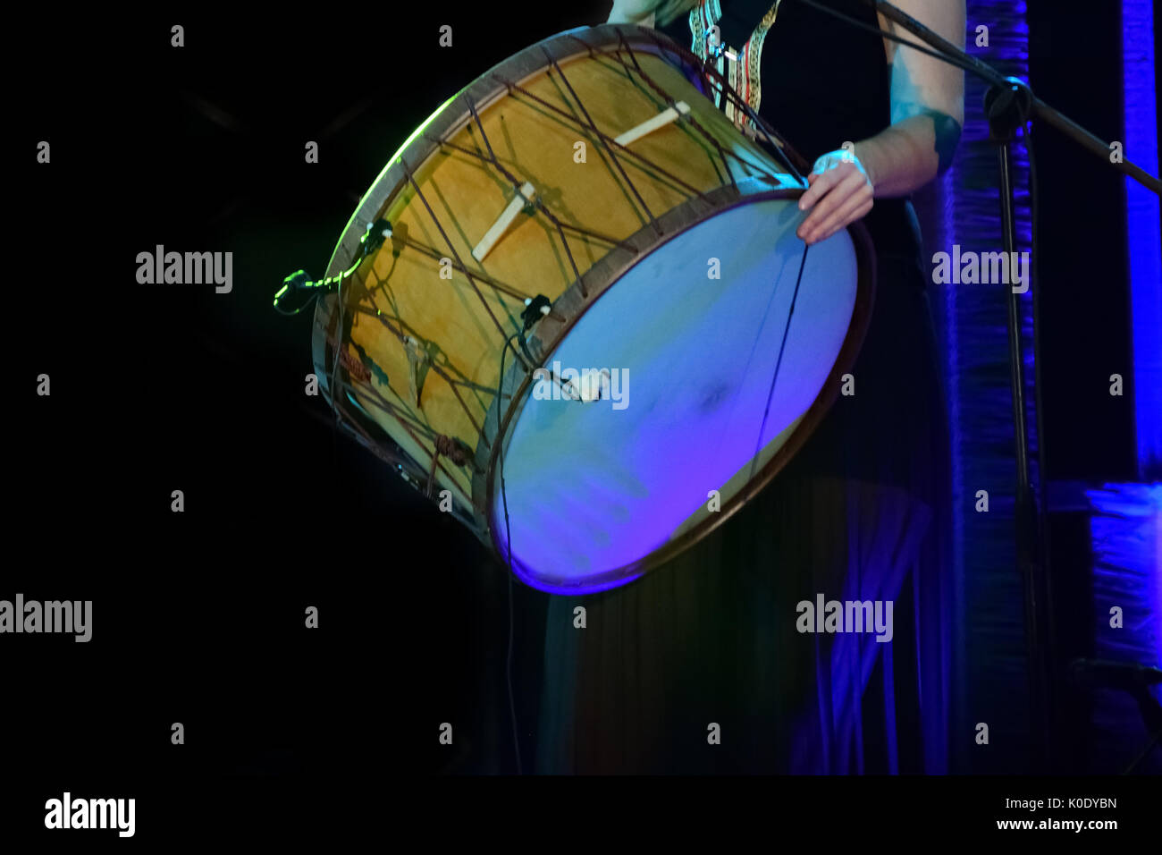 playing drum in a music concert on black background Stock Photo - Alamy