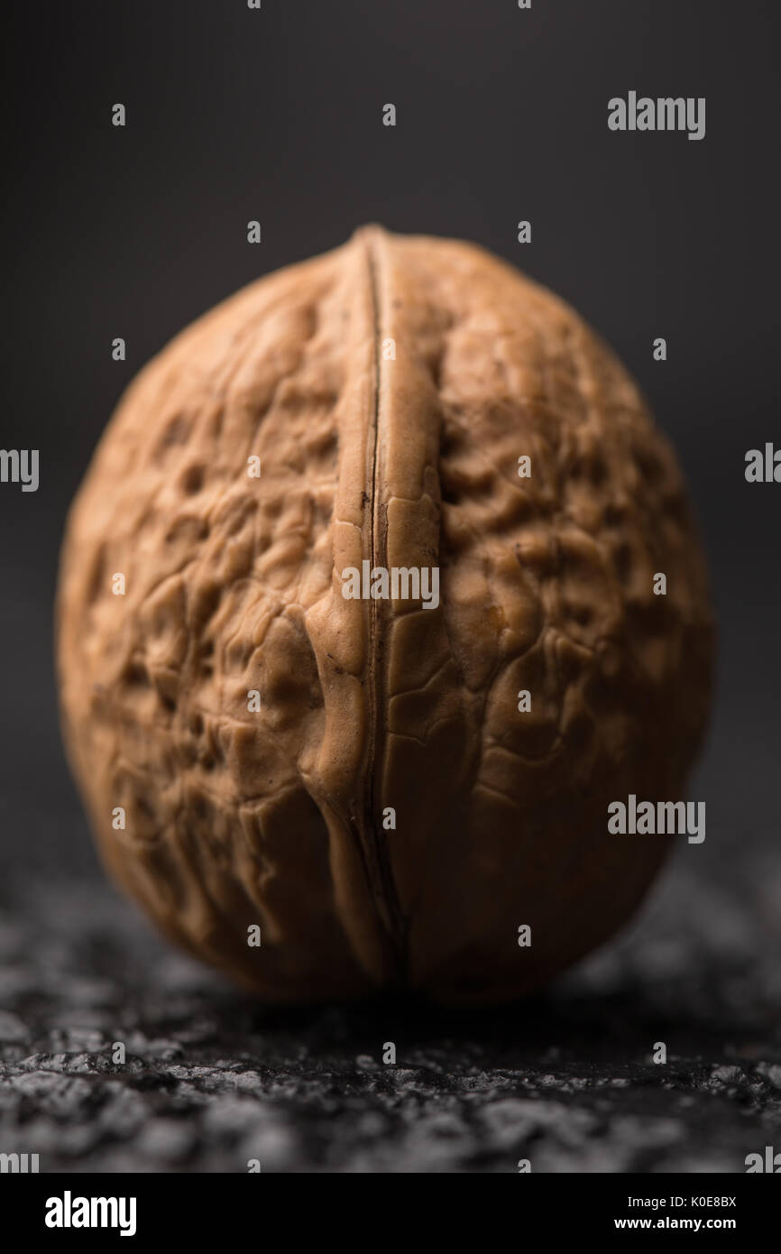 Walnut shell in open husk hi-res stock photography and images - Alamy