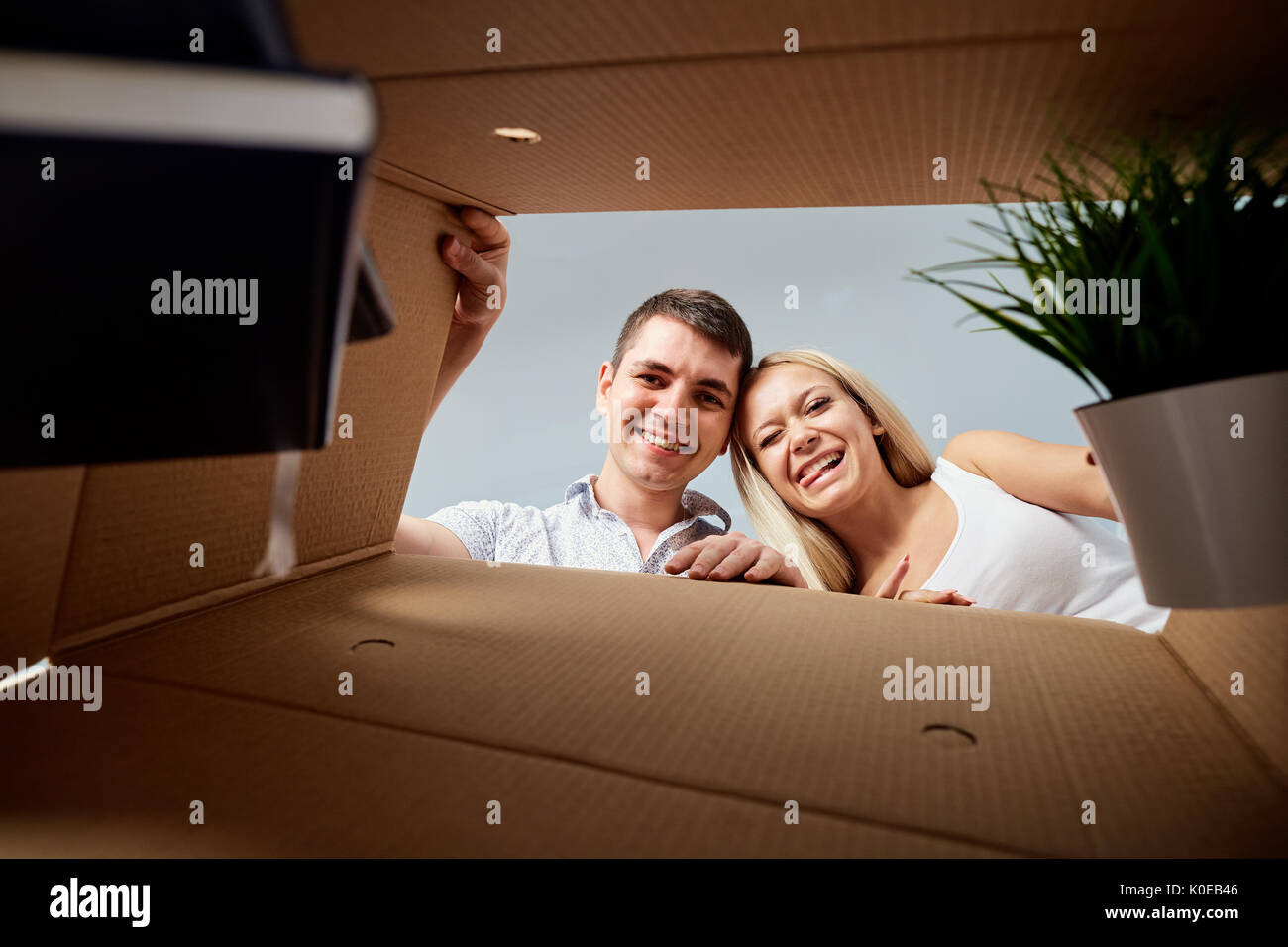 Couple opening cardboard boxes hi-res stock photography and images - Alamy
