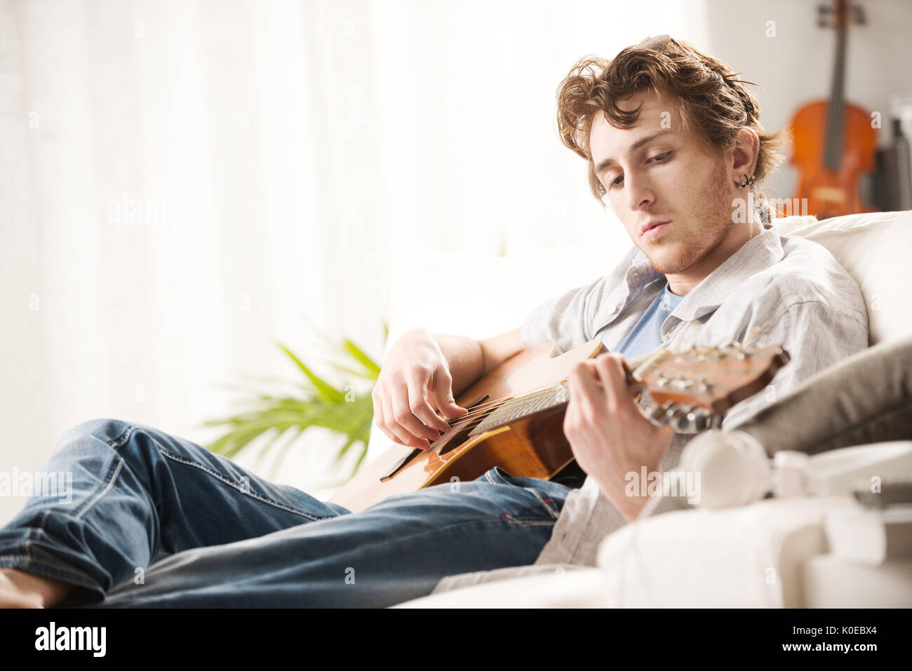Young man playing a violin hi-res stock photography and images - Alamy
