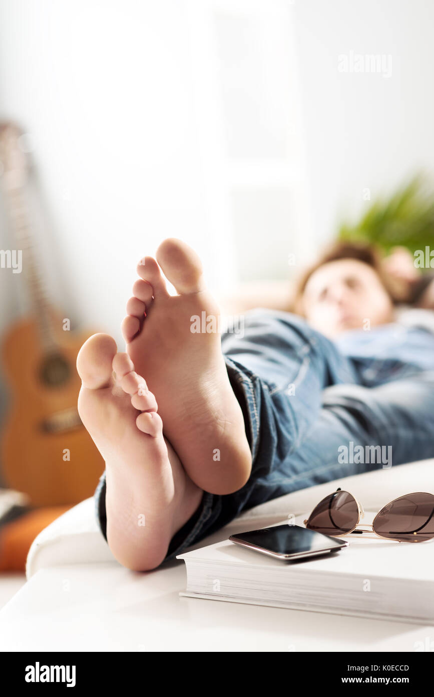Guy lying down feet up hi-res stock photography and images - Alamy