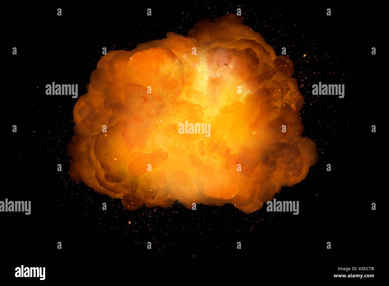 Realistic bomb explosion, orange color with sparks isolated on black ...