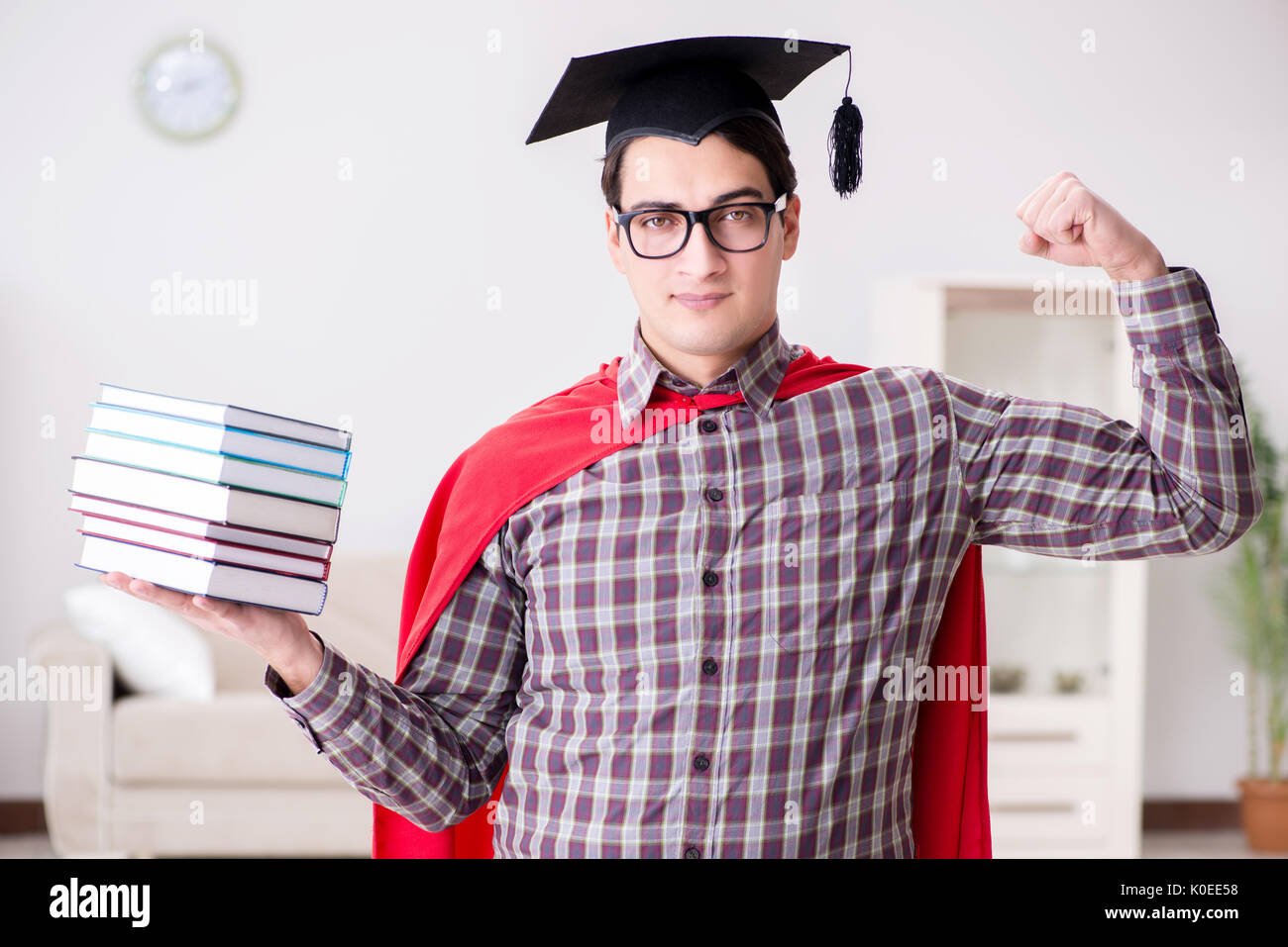 Super hero student with books studying for exams Stock Photo - Alamy