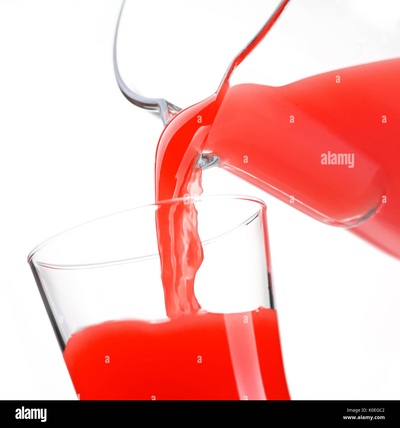 Glass with splashing red grape juice hi-res stock photography and ...