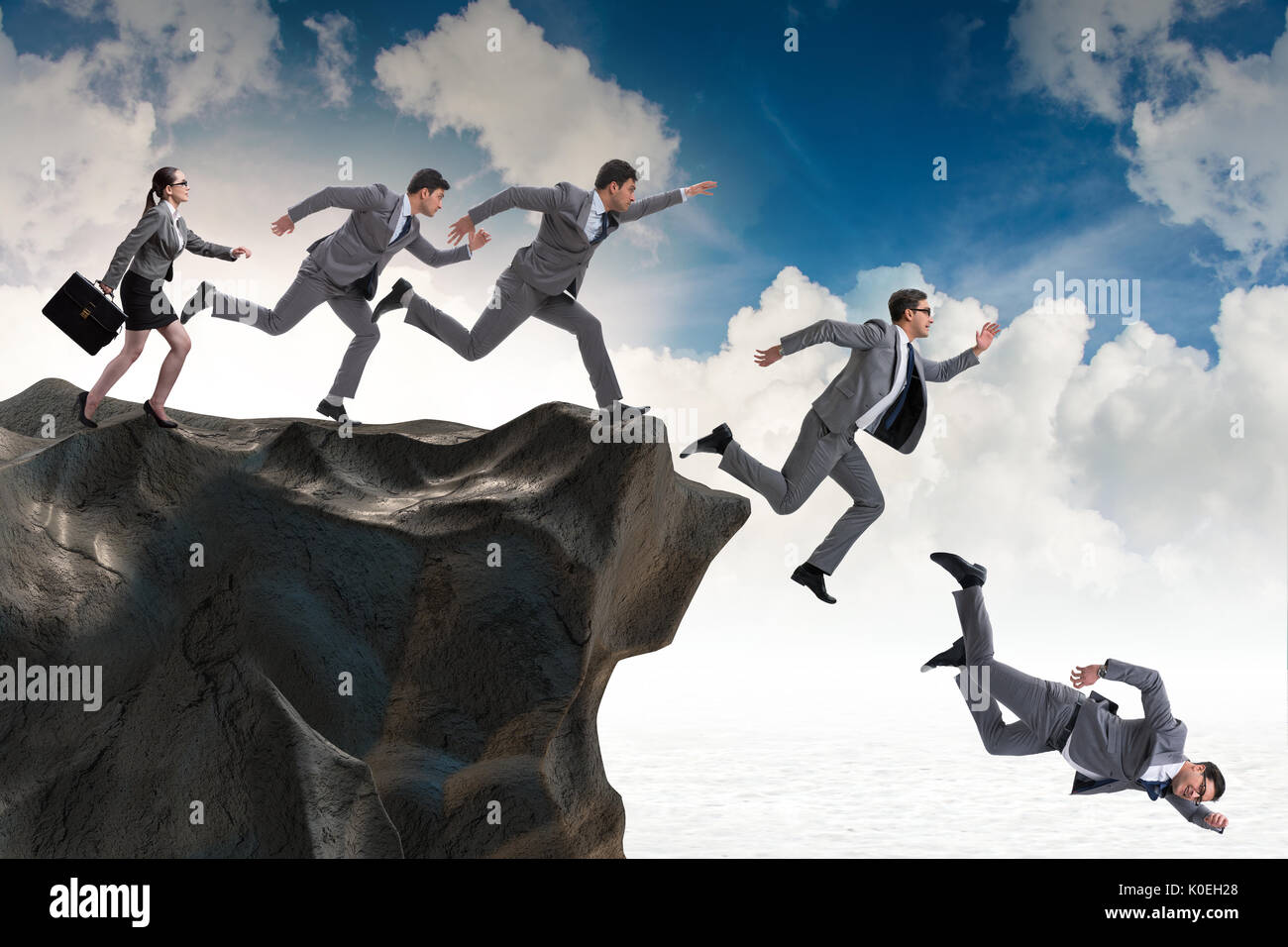 Business people falling off the cliff Stock Photo - Alamy