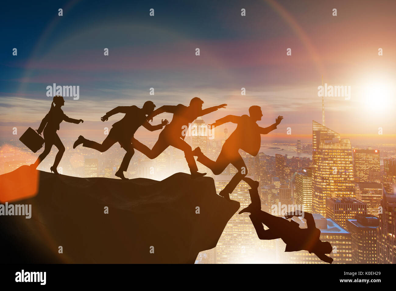 Business people falling off the cliff Stock Photo - Alamy