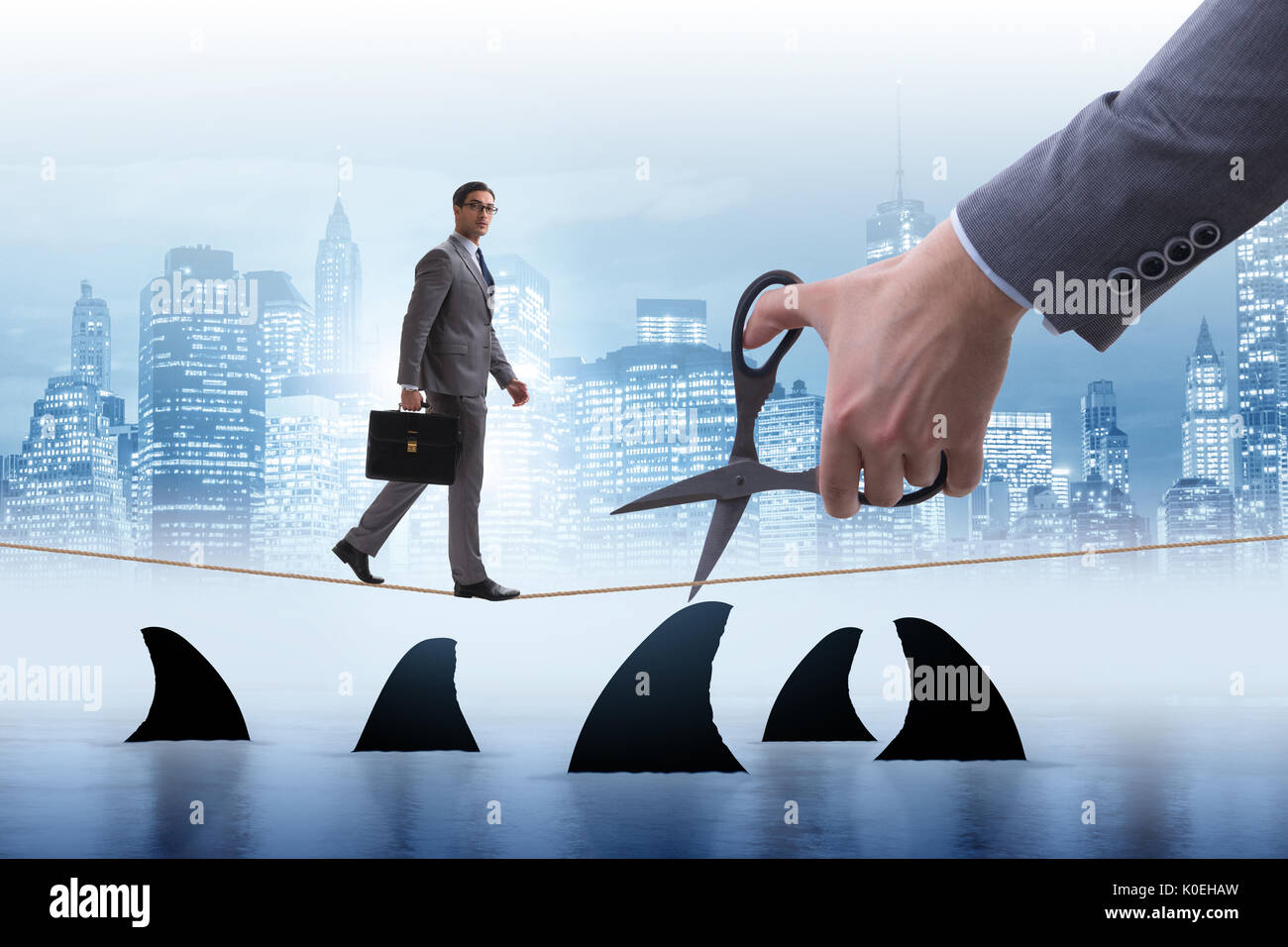 Hand cutting rope in business risk concept Stock Photo - Alamy