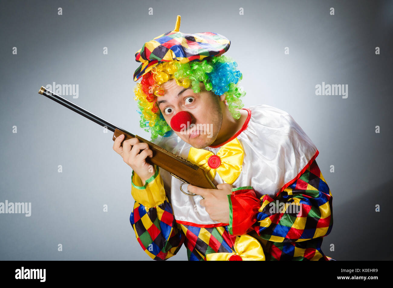 Funny clown in comical concept Stock Photo - Alamy