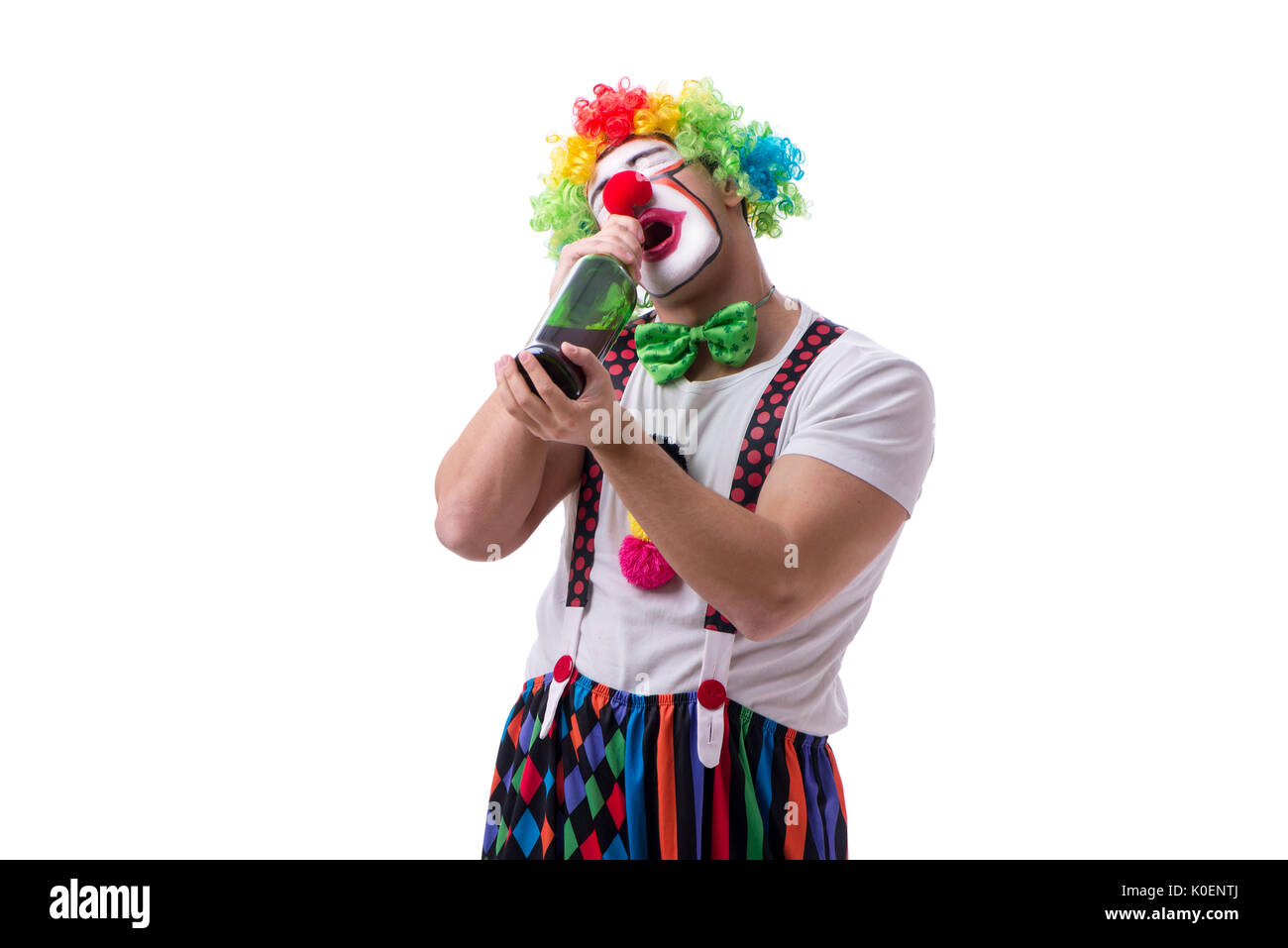Funny clown with a bottle isolated on white background Stock Photo - Alamy