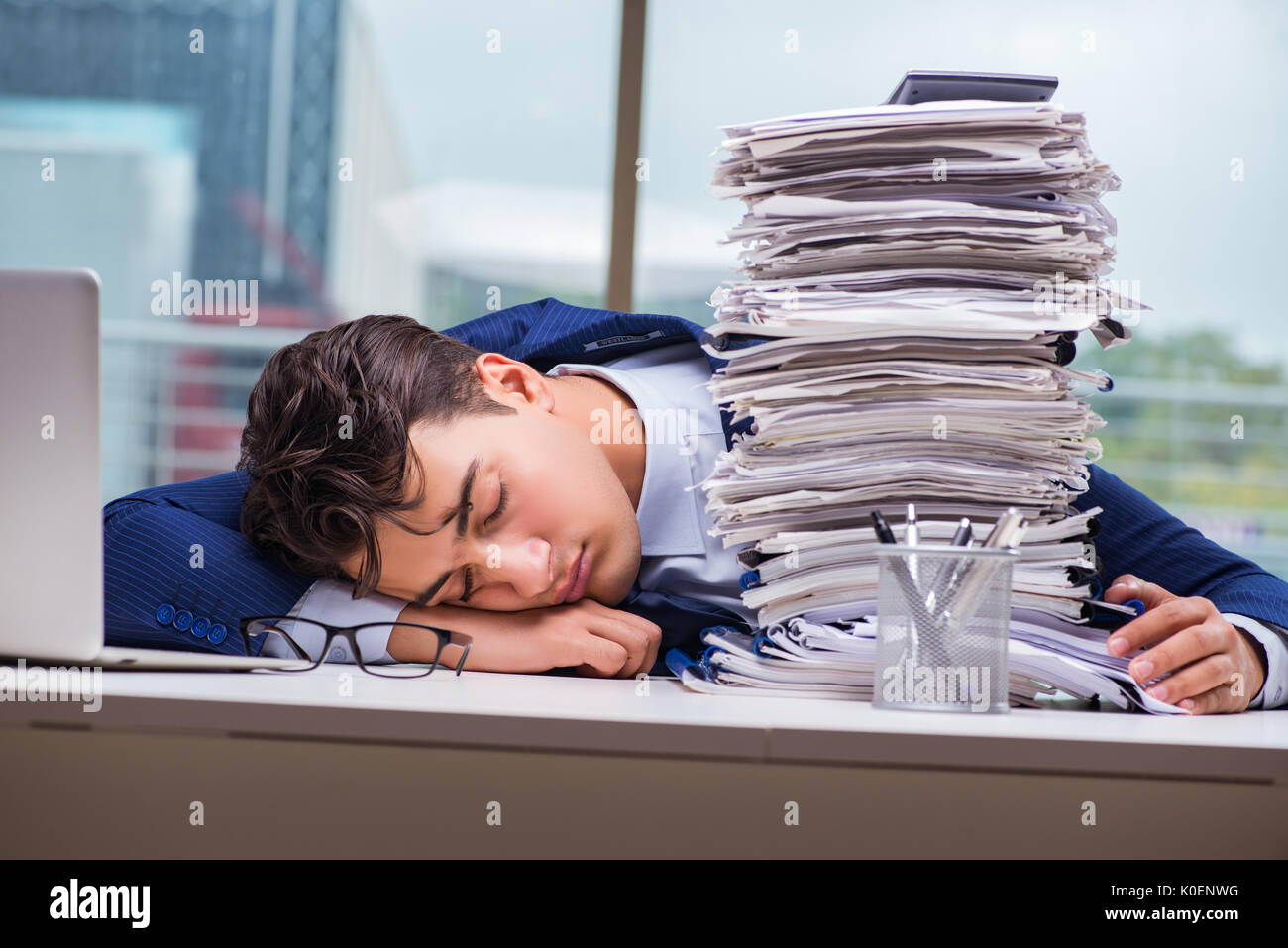 Businessman with pile stack of paper paperwork in the office Stock ...
