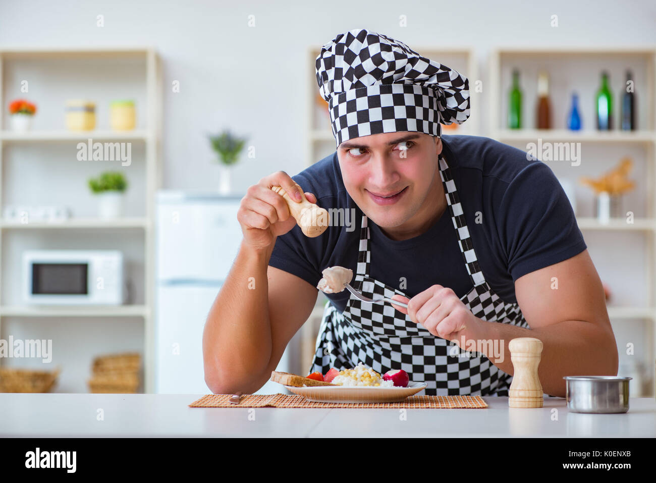 Chef cook cooking a meal breakfast dinner in the kitchen Stock Photo ...