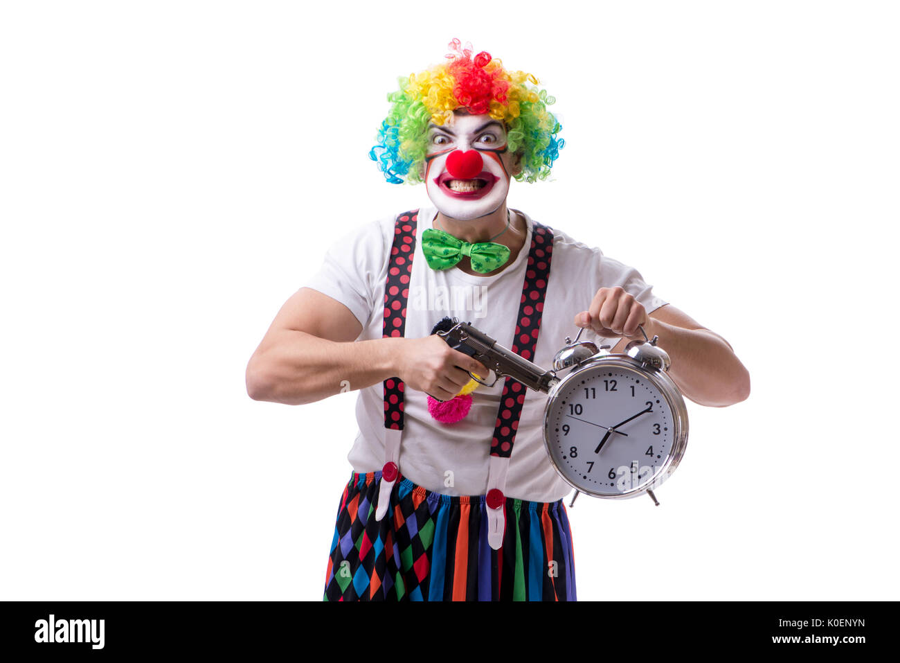 Funny clown with an alarm clock isolated on white background Stock ...