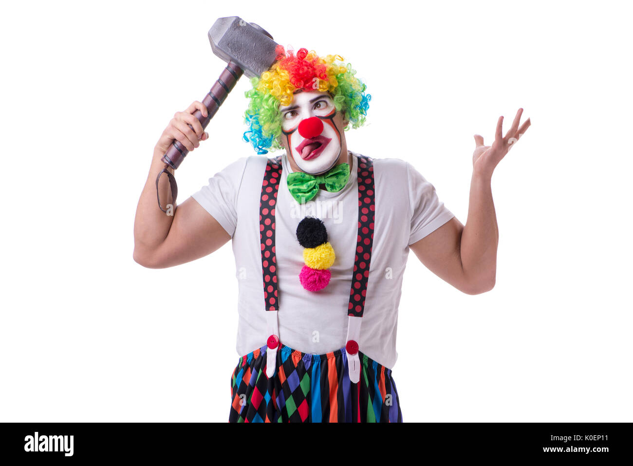 Funny clown with a hammer isolated on white background Stock Photo - Alamy