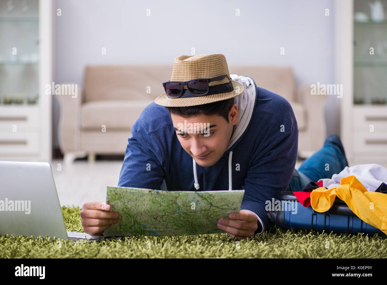Man planning his vacation trip with map Stock Photo - Alamy
